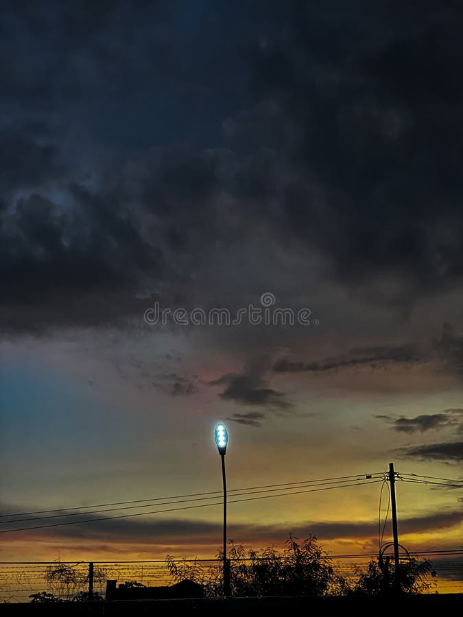 The Street Lights are on in the Evening Stock Photo - Image of dark ...