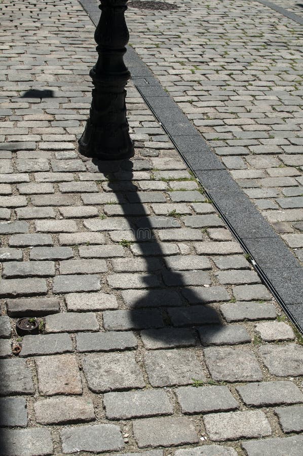 Street Pillar Shadow on Pavement Stock Image - Image of gray ...