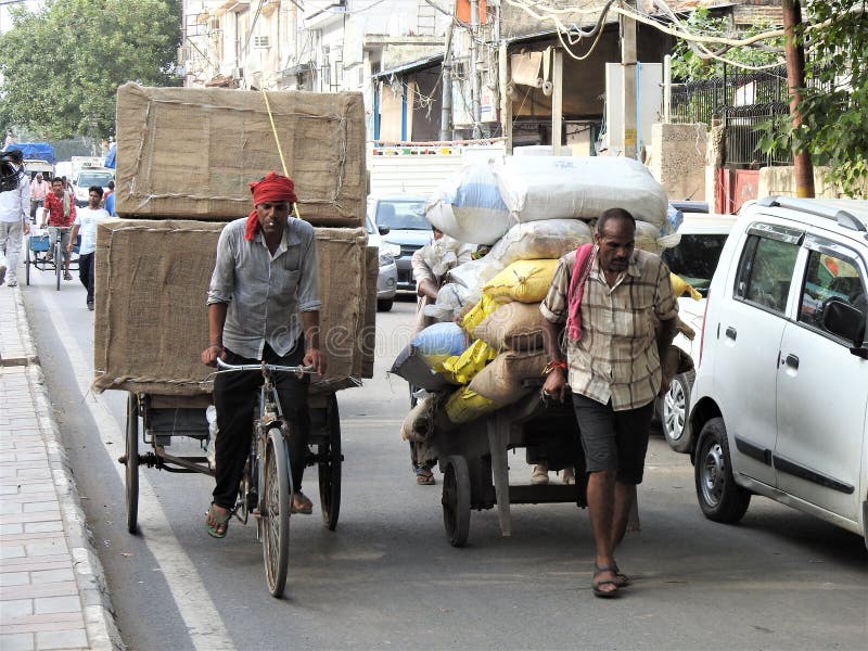 Street Scene in Old Delhi India. Men at Work Working really Hard ...