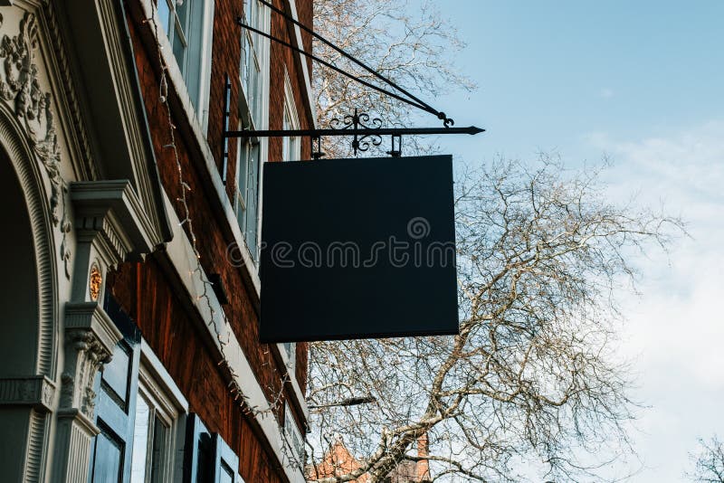 Street Scenery of a Black Empty Sign Hanging from a Building Stock ...