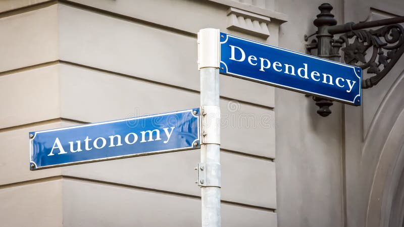 Street Sign To Autonomy Versus Dependency Stock Photo - Image of ...