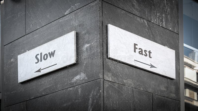 Street Sign To Fast Versus Slow Stock Photo - Image of smartphone ...