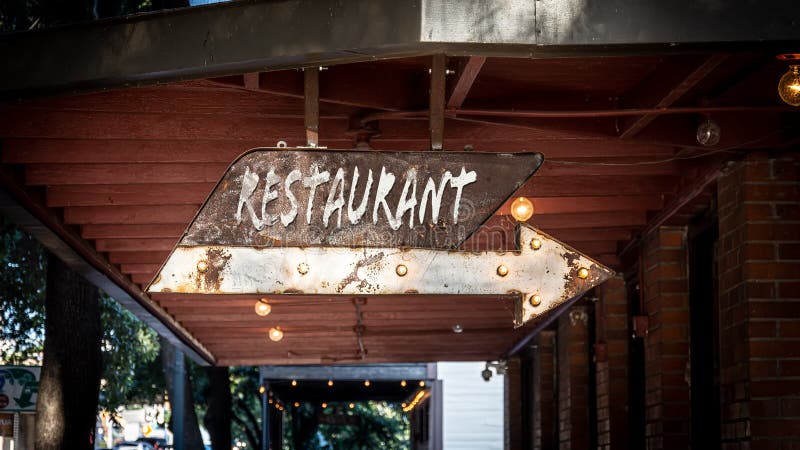 Street Sign to Restaurant stock image. Image of tavern - 202523073