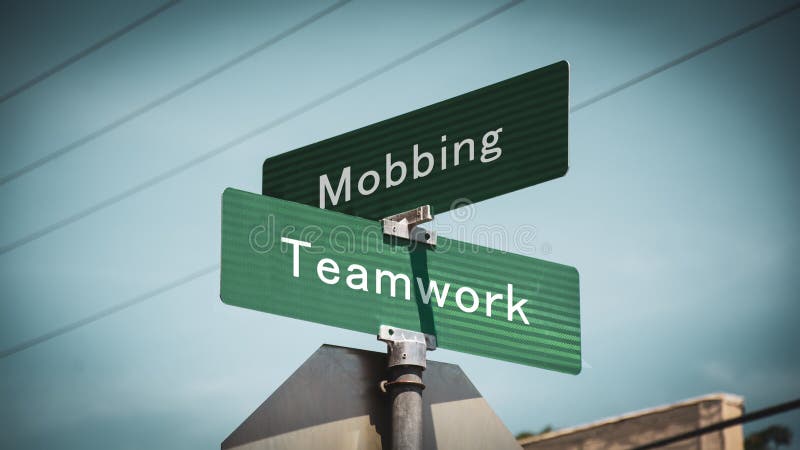 Street Sign To Teamwork Versus Mobbing Stockbild - Bild von ...