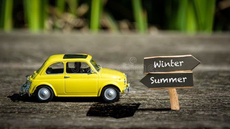 Street Sign To Winter Versus Summer Stock Image - Image of winter ...