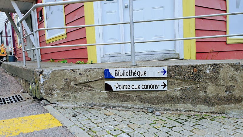 Street Signs in Front of a Building Below Stock Image - Image of ...