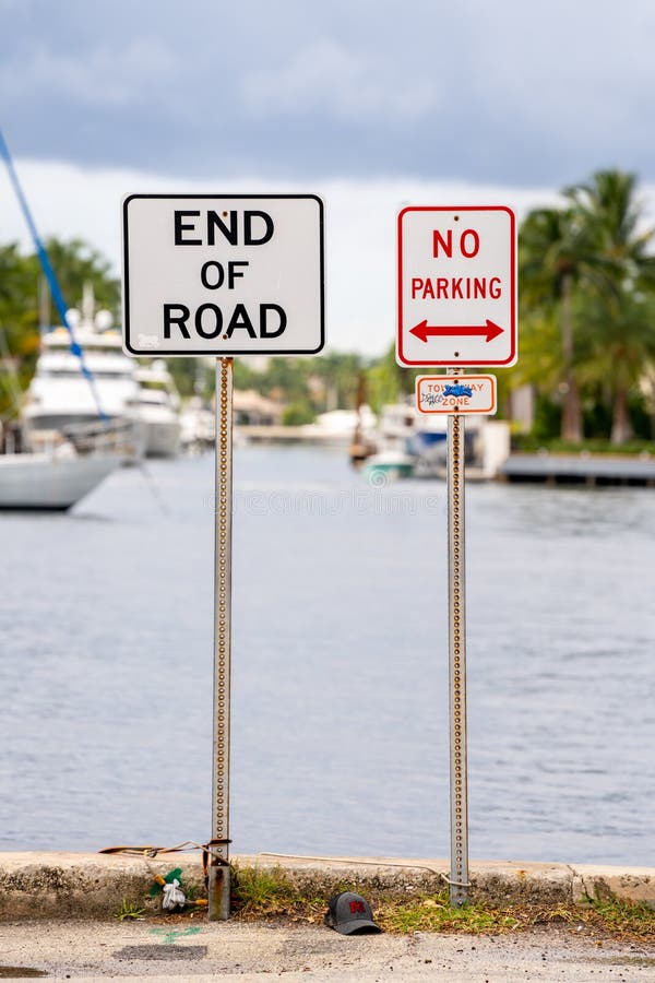 Street Signs Reading End of Road and No Parking Stock Image - Image of ...