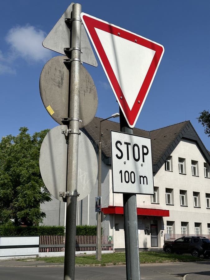 Street Signs at the Road Crossing Stock Photo - Image of metal, house ...