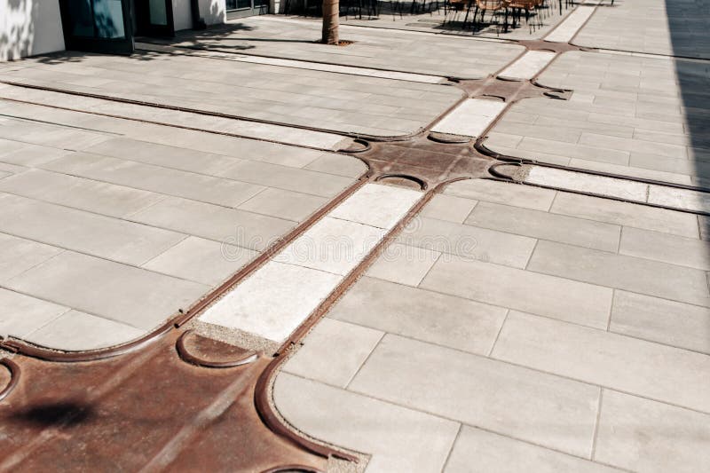 Street Tiles with Metal Ground Surface Indicators, Closeup Stock Photo ...