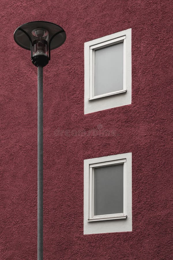 Streetlamp in Front of a Dark Red Building Stock Photo - Image of ...