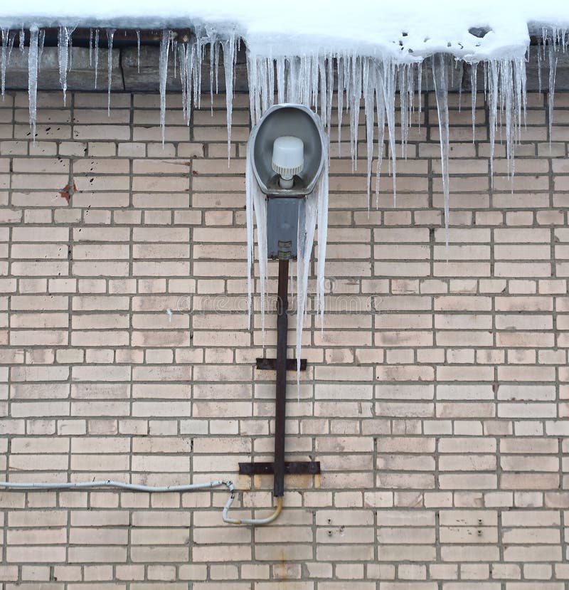 Streetlight on a Brick Wall Surrounded by Icicles Stock Photo - Image ...