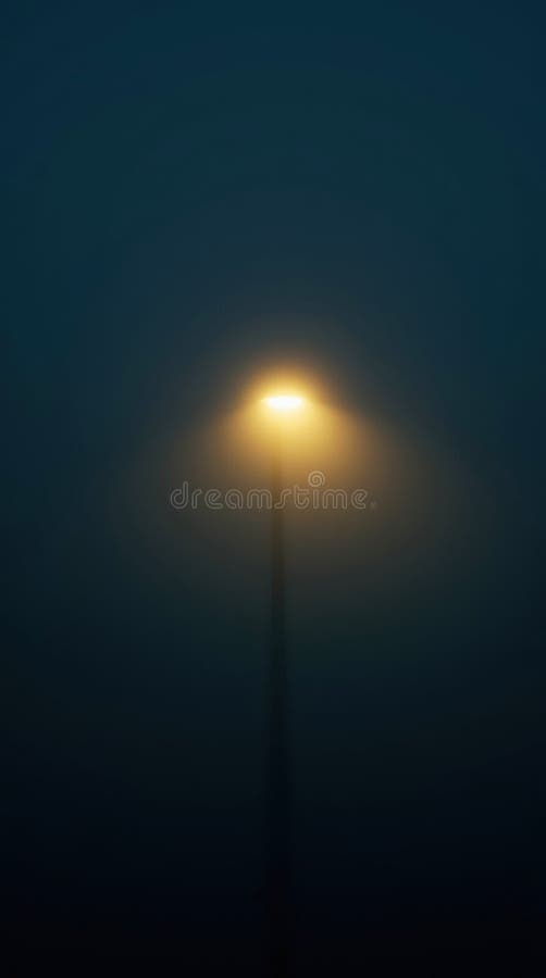 Streetlight Shining through Dense Fog on a Silent Night Stock ...