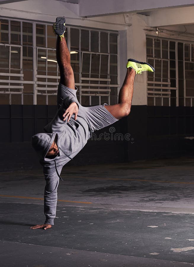 Strength and Form. a Full Length Shot of a Young Man Breakdancing ...