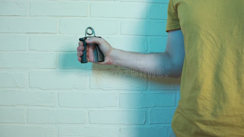 Strength Training Exercise with Hand Gripper Against a Minimalistic ...