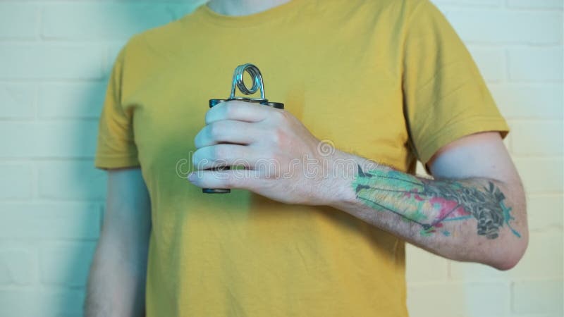 Strength Training Exercise with Hand Gripper Against a Minimalistic ...