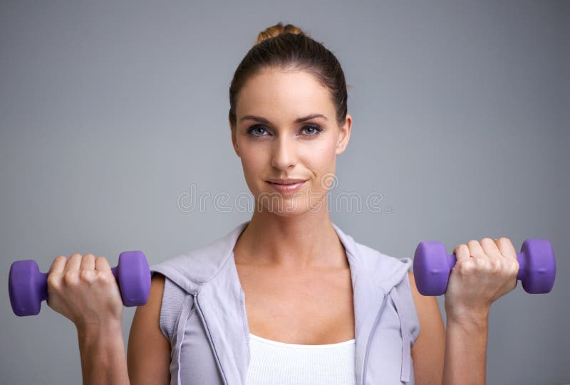 Strengthening Her Core. Shot of an Attractive Young Woman Working Out ...