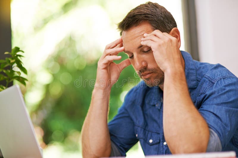 The Stress is Getting To Him. a Man Suffering from a Headache while ...