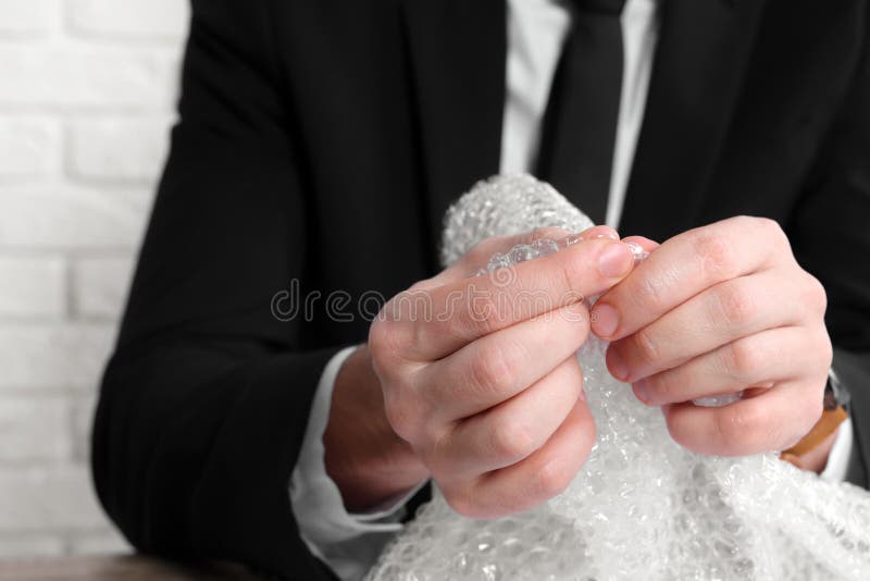 Stress Relief. Businessman Popping Bubble Wrap, Closeup View. Space for ...