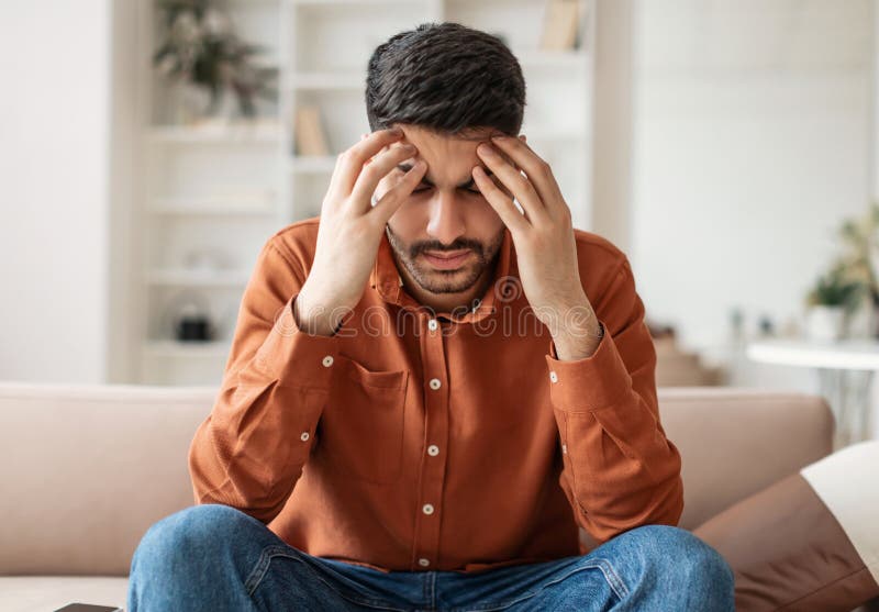 Stressed Arab Man Sitting on Couch and Thinking Stock Image - Image of frustrated, making: 380320311