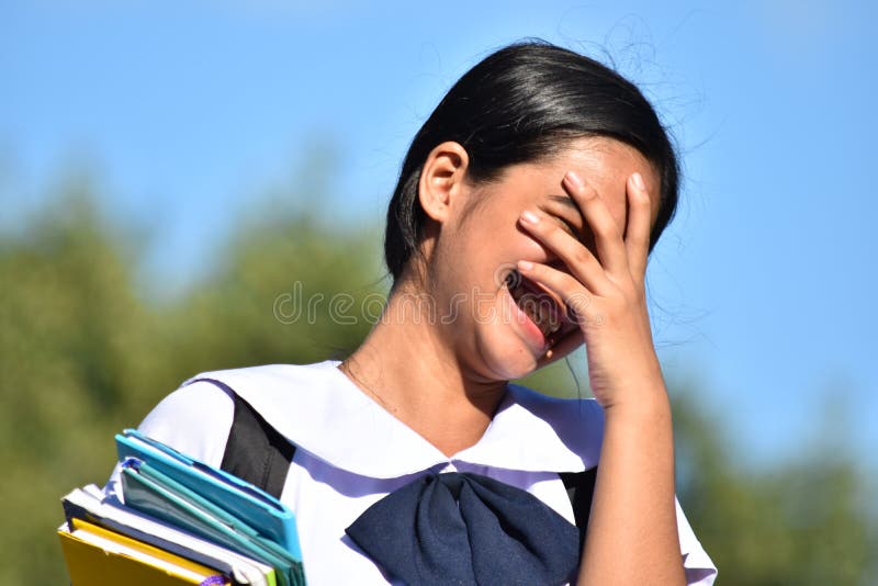 Stressed or Ashamed Female Student Holding Books Stock Photo - Image of ...