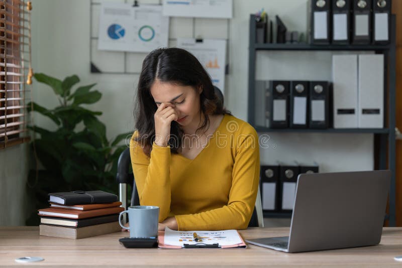 Stressed Asian Business Woman Worry with Many Document on Desk at ... Stressed Asian Business Woman Worry with Many Document on Desk at ...