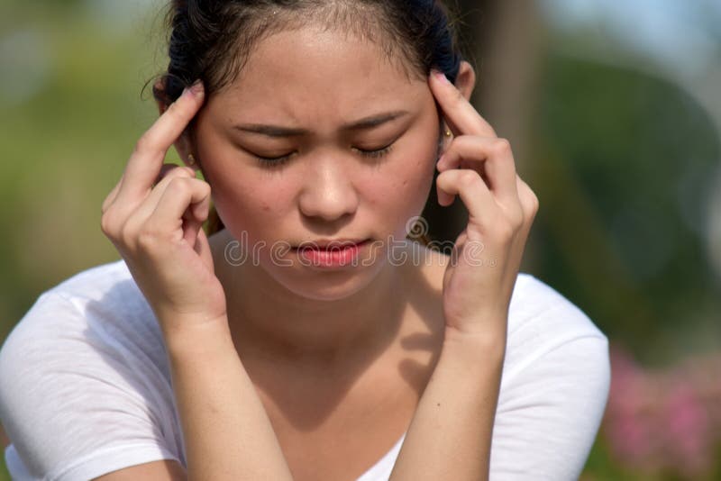 A Stressed Asian Female stock image. Image of nervous - 141755195
