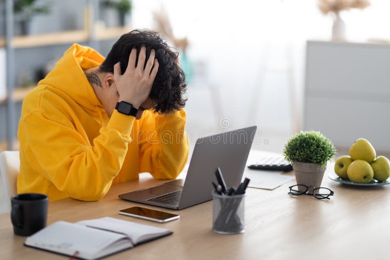 Stressed Asian Male Sitting at Desk Using Pc Grabbing Head Stock Photo ...