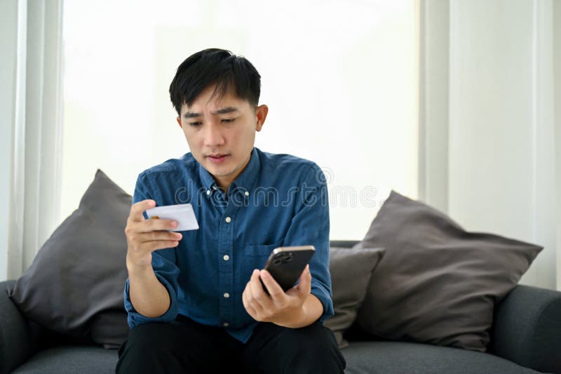 Happy Asian Man Using Mobile Banking Application To Pay His Bills ...