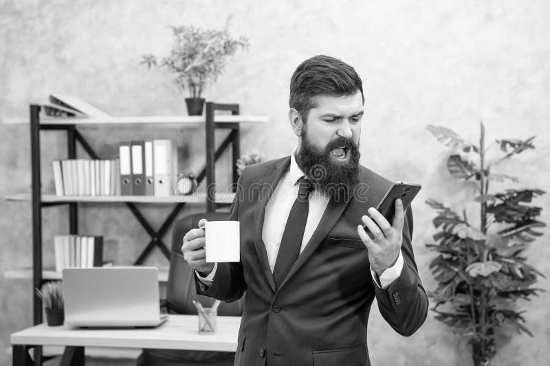Stressed Boss Yelling in Anger while Talking on Mobile Phone in Office ...