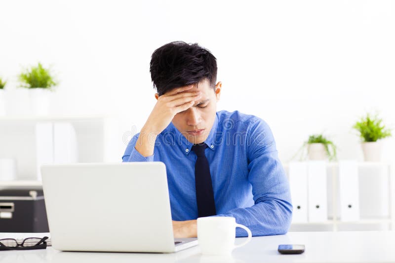 Stressed Man Working at Desk in Busy Creative Office Stock Image ...