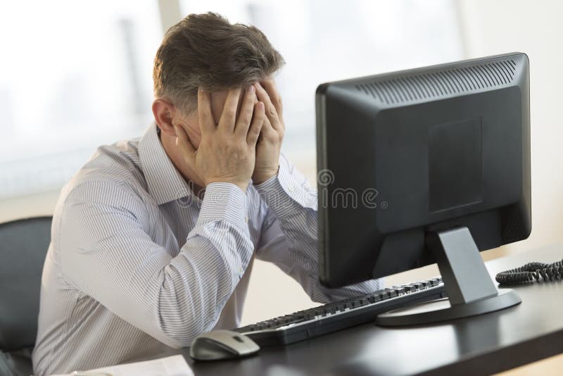 Stressed Businessman Leaning on Computer Desk Stock Image - Image of ...