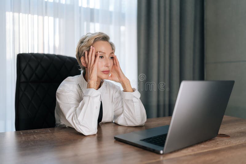 Stressed Concerned Middle-aged Business Woman Working on Laptop ...