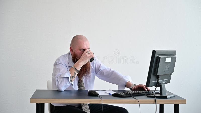 Stressed Crazy Businessman Breaking a Keyboard on His Monitor in the ...