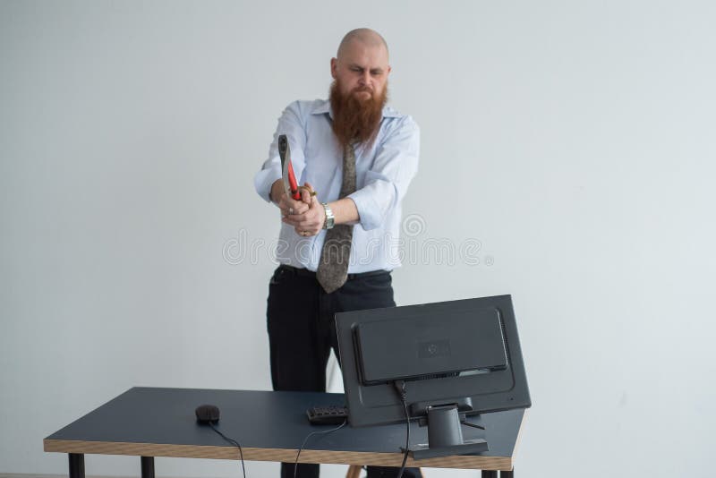 Stressed Crazy Businessman Smashing His Computer in Office Using Ax ...