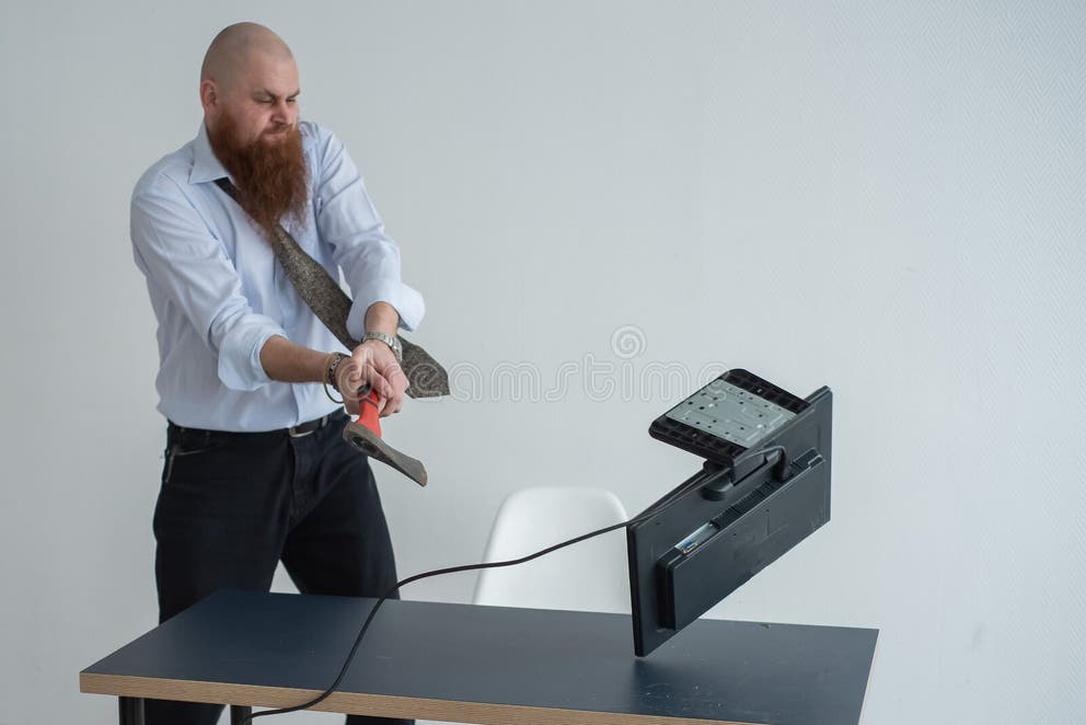 Stressed Crazy Businessman Smashing His Computer in Office Using Ax ...