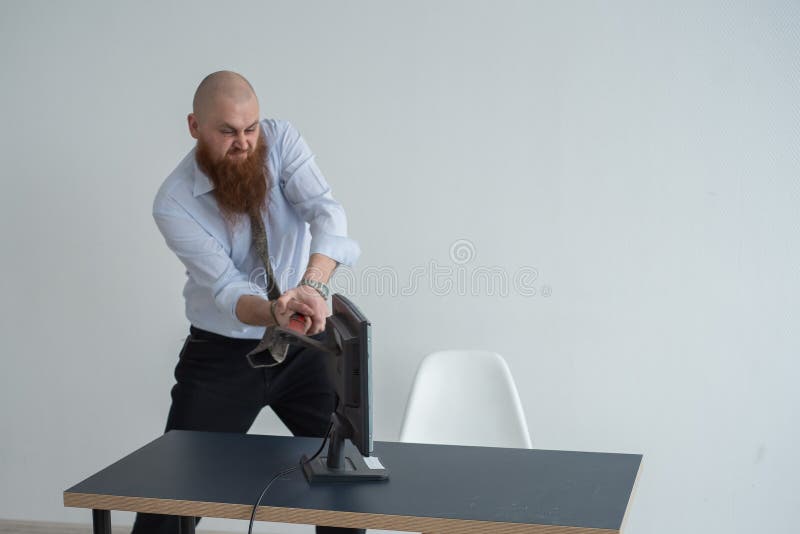 Stressed Crazy Businessman Smashing His Computer in Office Using Ax ...