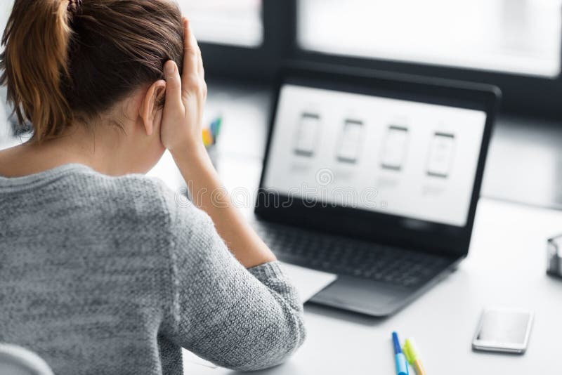 Stressed Designer with User Interface on Laptop Stock Photo - Image of ...