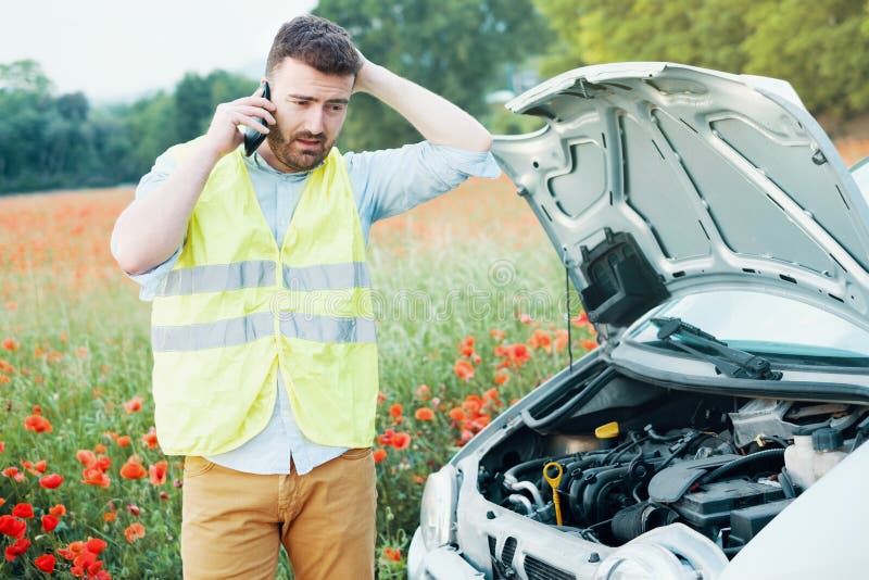 Stressed Driver after Car Breakdown Calling Roadside Service Stock ...