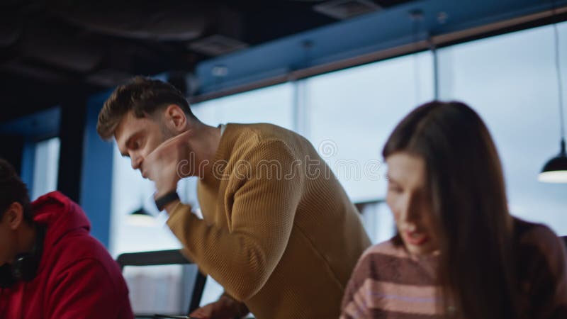 Stressed Executive Explaining Task To Office Team Working at Laptops ...