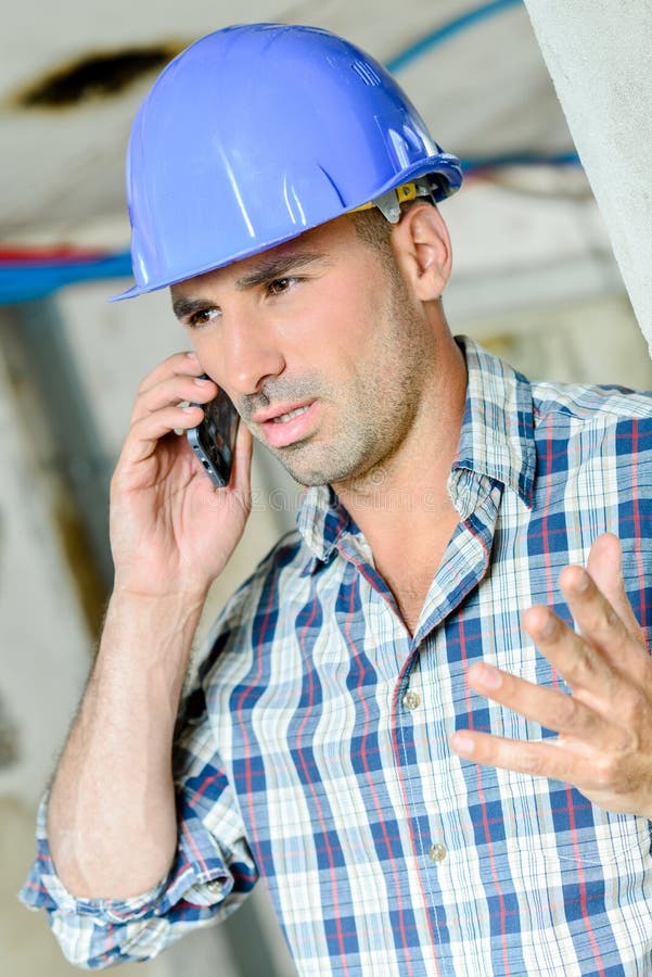 Stressed foreman at work stock image. Image of headgear - 245736367