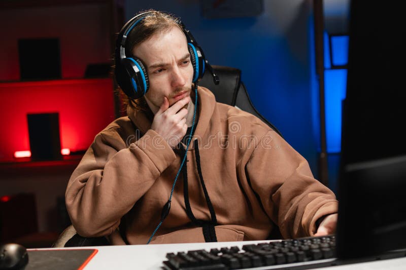 Stressed Gamer Playing Computer Games Sitting in the Living Room at ...