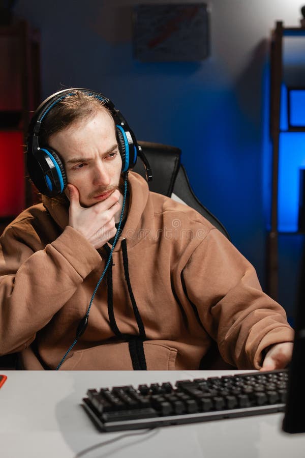 Stressed Gamer Playing Computer Games Sitting in the Living Room at ...