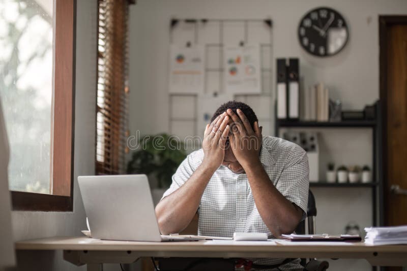 Stressed Male Office Worker Struggling with Deadlines and Workload in a ...