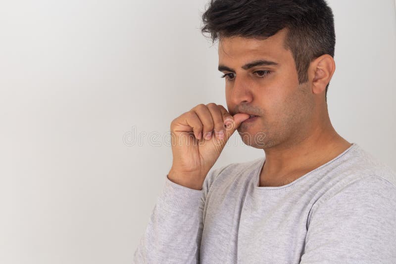 Stressed Man Biting Finger Nails on Isolaned Background Stock Photo ...