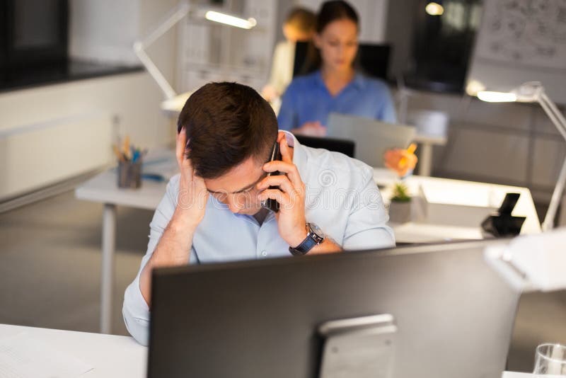 Stressed Man Calling on Smartphone at Night Office Stock Image - Image ...
