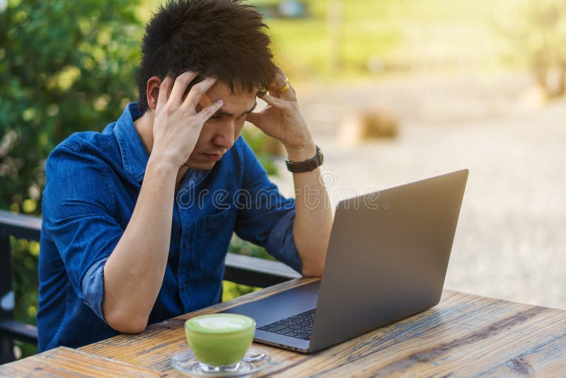 Stressed Man Using Laptop Computer Stock Photo - Image of face, garden ...