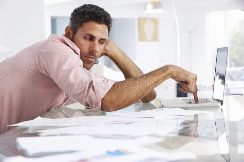 Stressed Man Working at Desk in Busy Creative Office Stock Photo ...