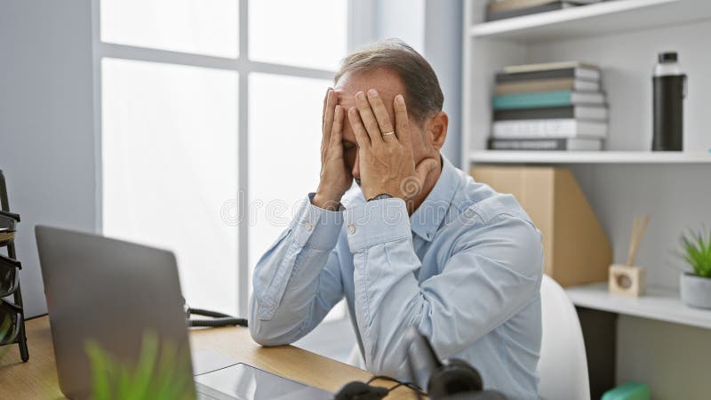 Stressed Middle Age Man, Working Tirelessly at His Office Desk ...