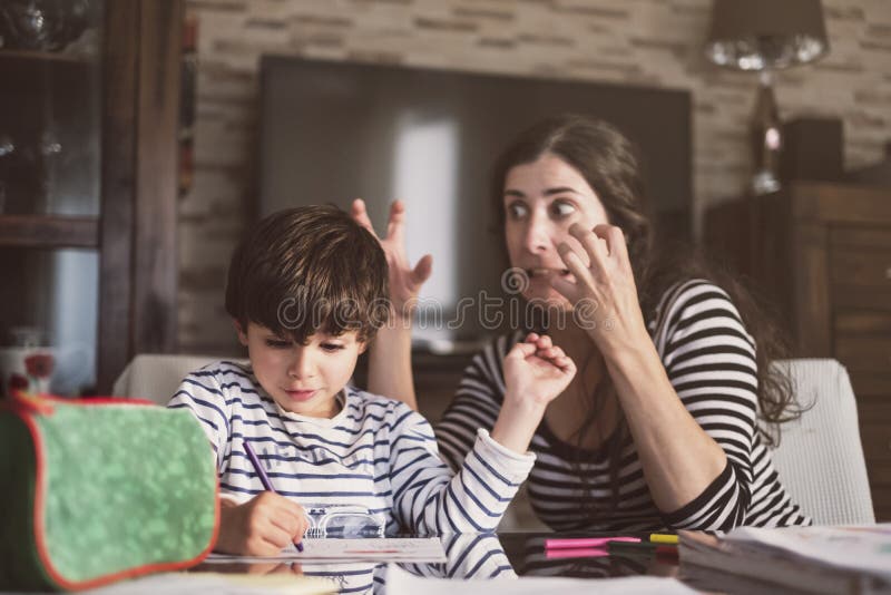 Stressed Mother and Son Doing Homework at Home Stock Photo - Image of ...