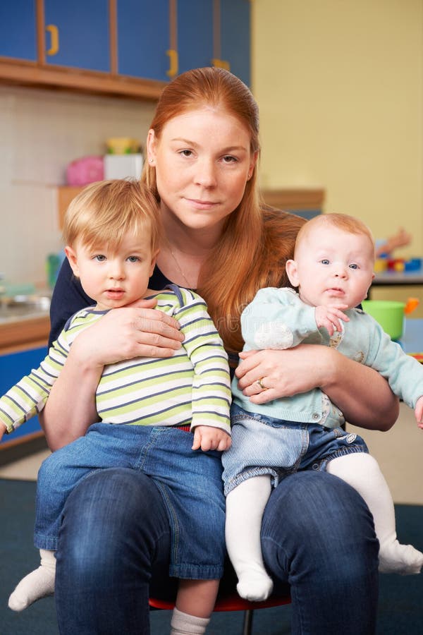 Stressed Mother with Two Young Children at Baby Group Stock Photo ...
